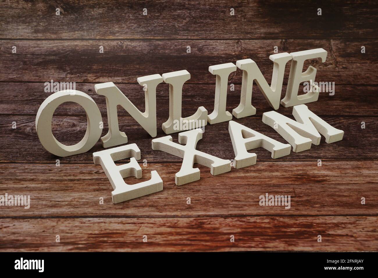 Online Exam Word alphabet letters on wooden background Stock Photo - Alamy