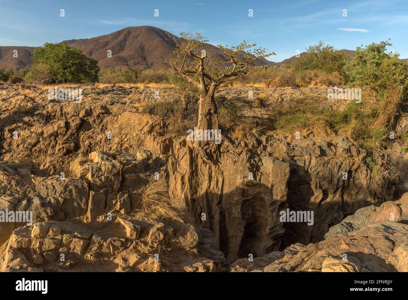 Landscape view of the Kunene River, the border river between Namibia ...