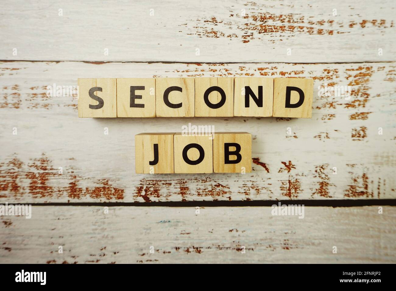 Second Job Word alphabet letters on wooden background Stock Photo - Alamy