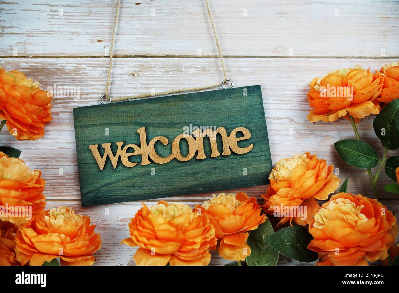 Welcome sign hanging on wooden with flower bouquet decoration Stock ...