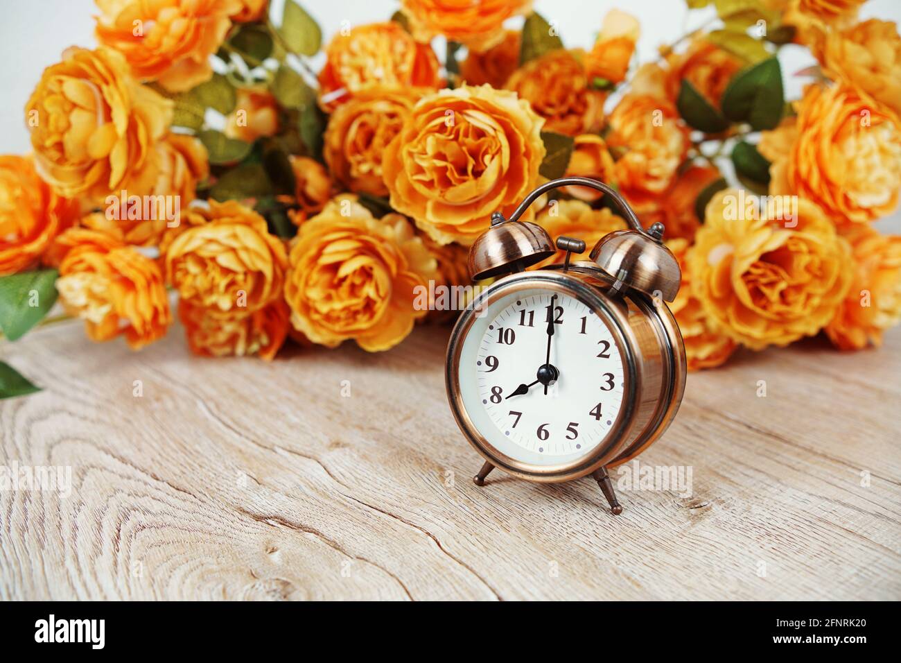 Vintage Alarm Clock And Flower Bouquet with space copy on wooden ...