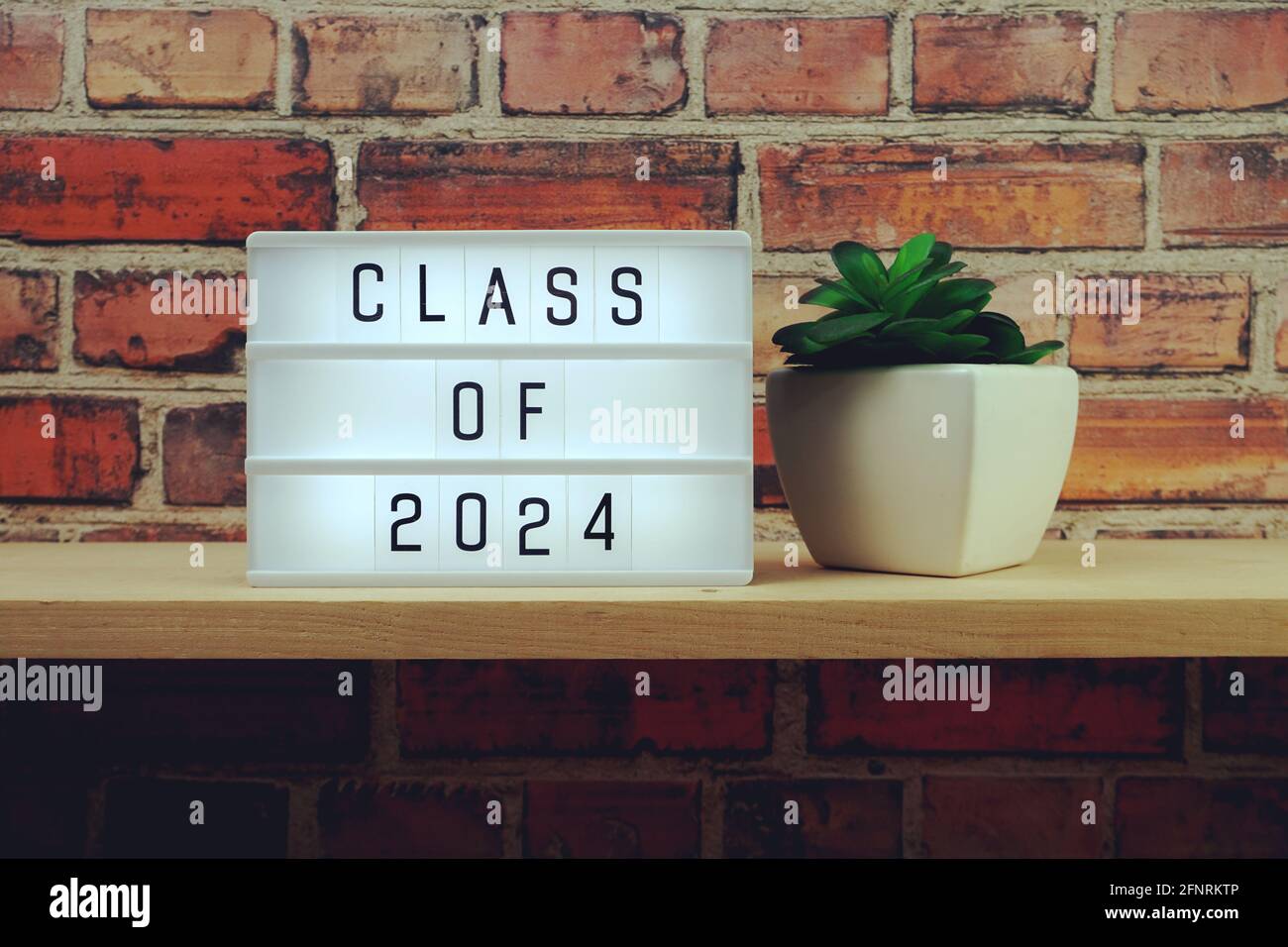 Class of 2024 alphabet letter on wooden background Stock Photo - Alamy