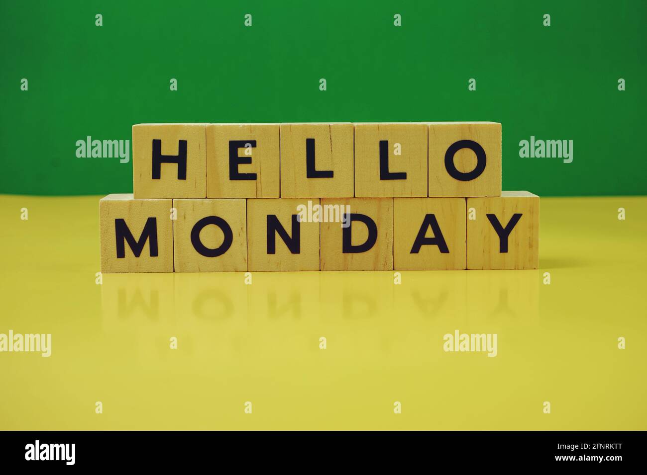 Hello Monday alphabet letter on green and yellow background Stock Photo ...