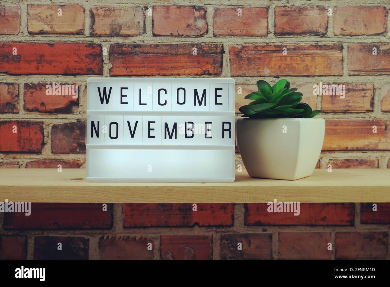 Welcome November word in light box on wooden shelves background Stock ...