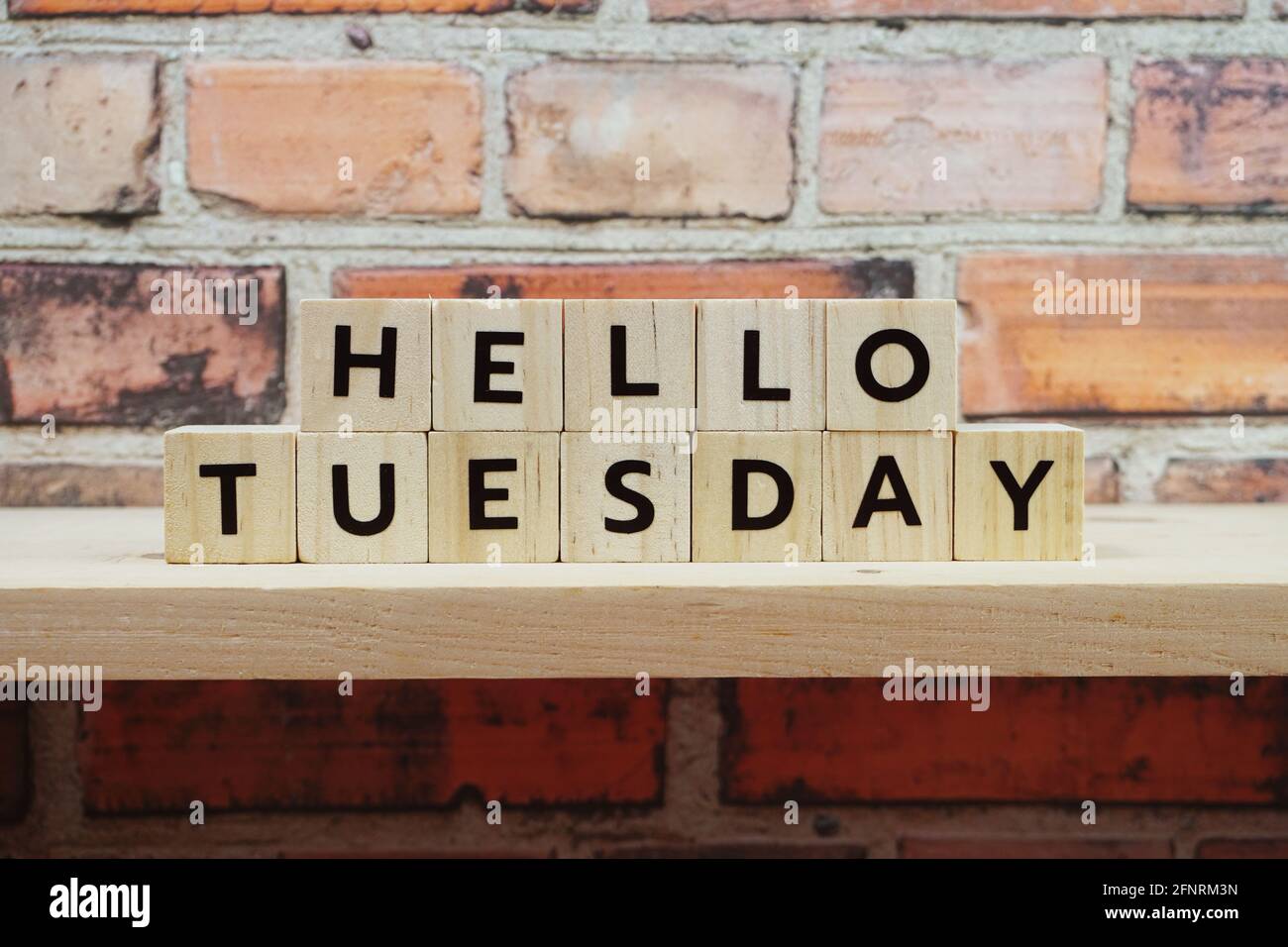 Hello Tuesday alphabet letter on shelves wooden background Stock Photo ...