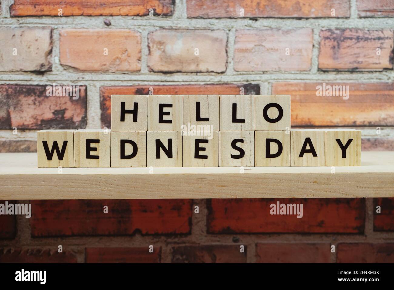 Hello Wednesday alphabet letter on shelves wooden background Stock ...