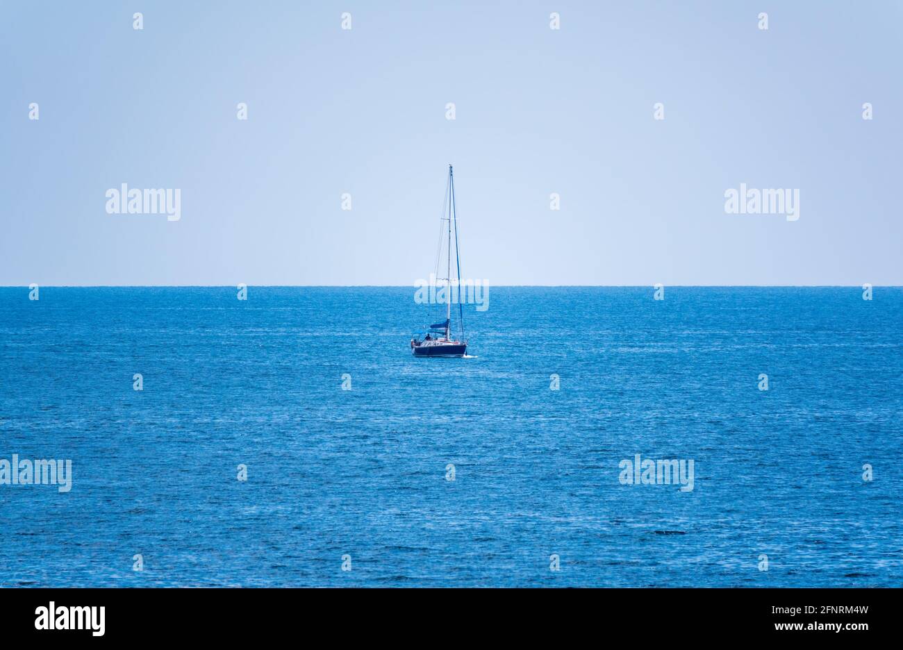 Sailing yacht in the blue calm sea. A yacht in peaceful waters Stock ...