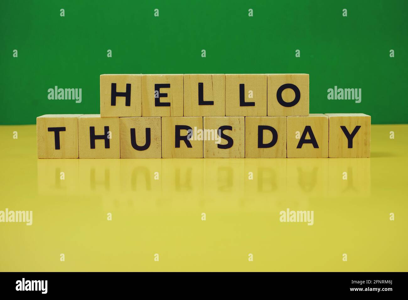 Hello Thursday alphabet letter on green and yellow background Stock ...