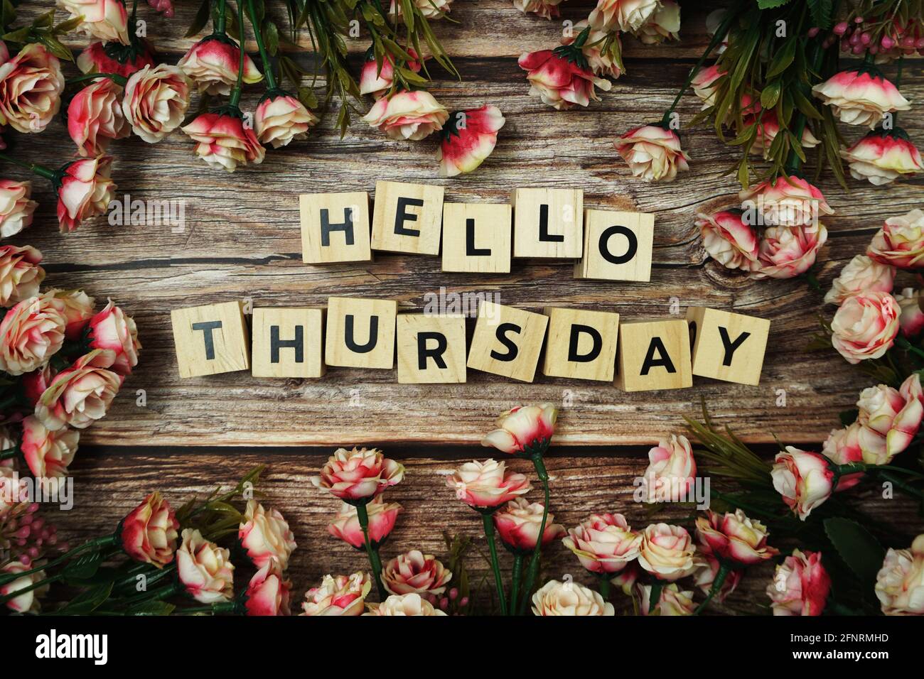 Hello Thursday alphabet letter with Blooming flower on wooden ...