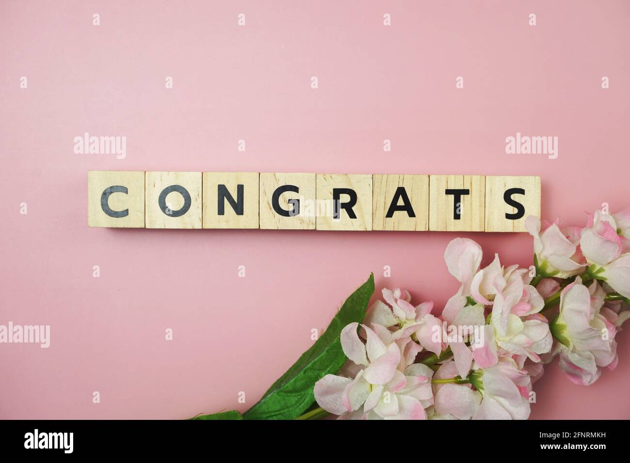 Congrats alphabet letter with Blooming flower on pink background Stock ...