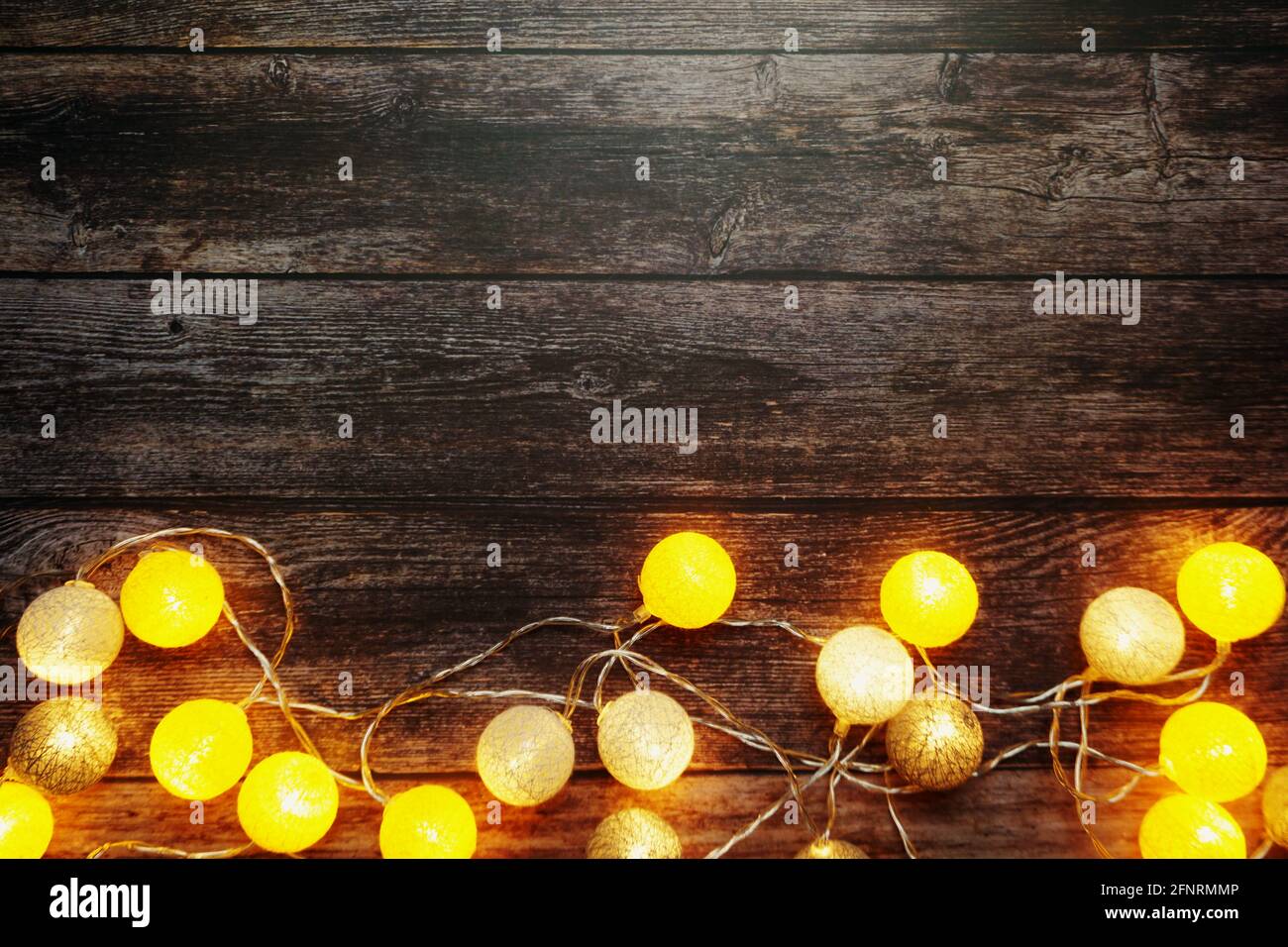 Colorful LED cotton ball decorative on woode background Stock Photo - Alamy