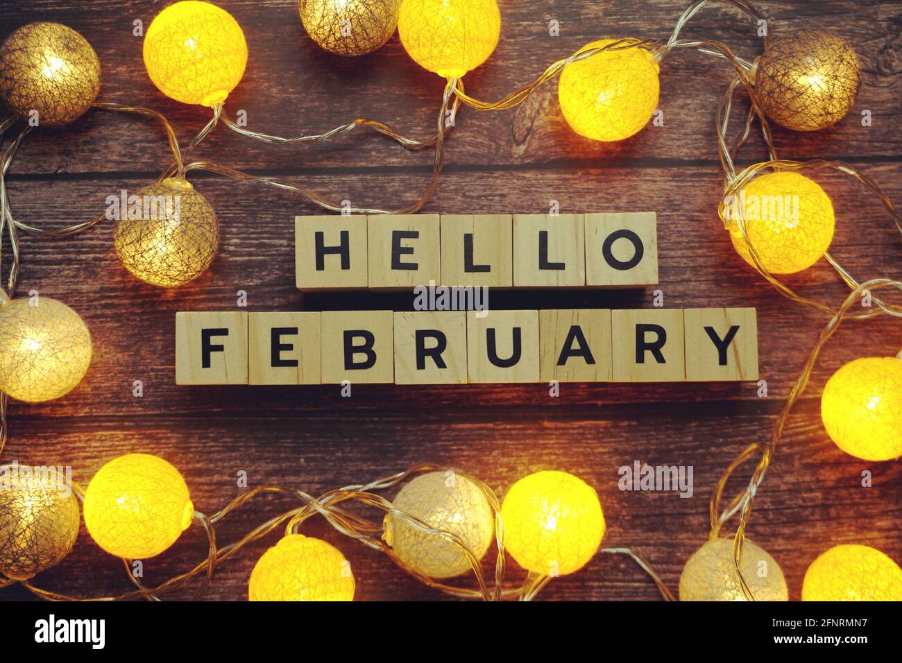 Hello February alphabet letter with LED cotton balls on wooden ...
