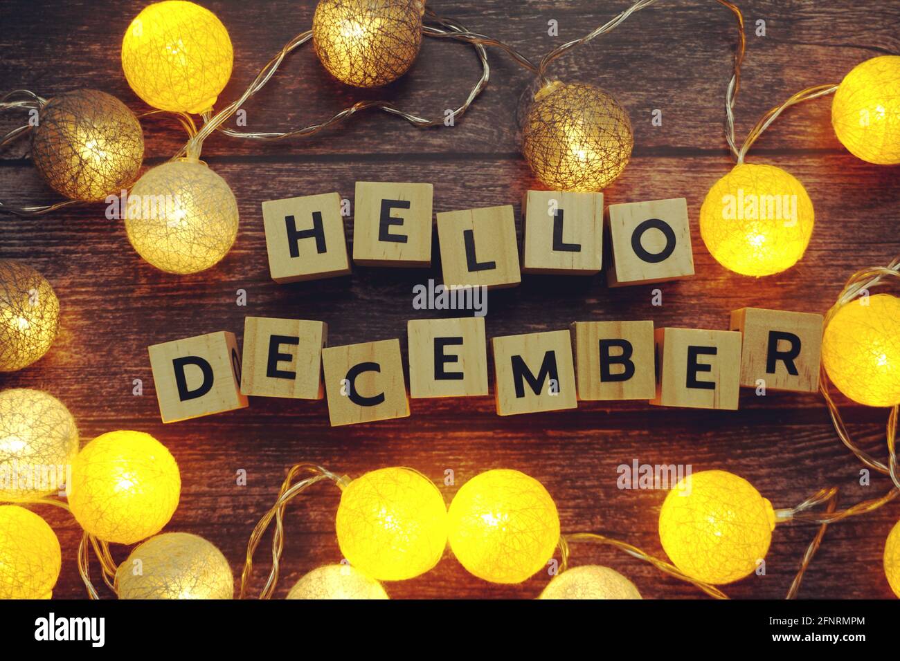Hello December alphabet letter with LED cotton balls on wooden ...