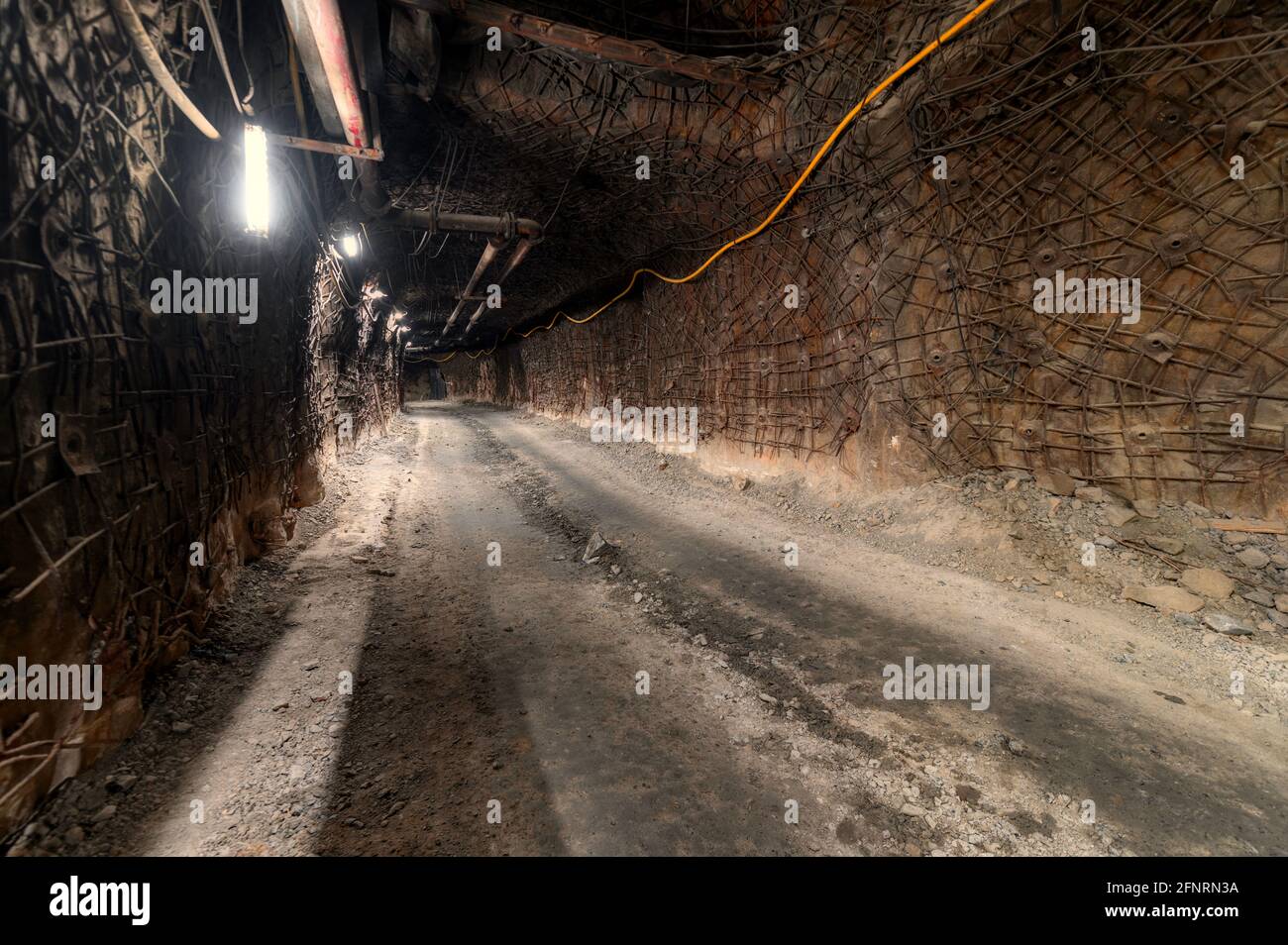 Underground mine. Underground road for transport. The walls and ceiling ...