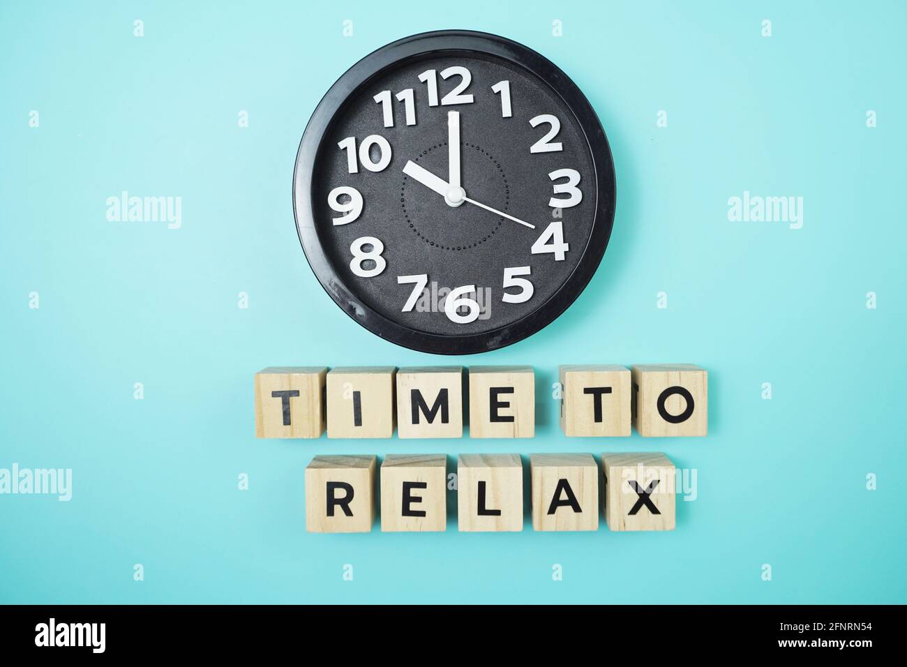 Time To Relax alphabet letter with alarm clock on blue background Stock ...