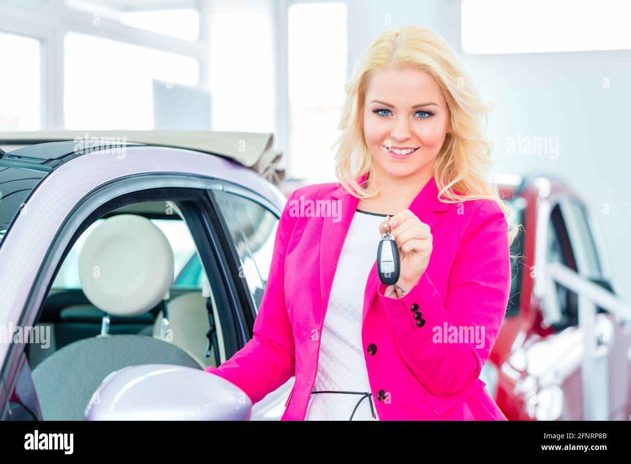 Woman buying car dealership hi-res stock photography and images - Alamy