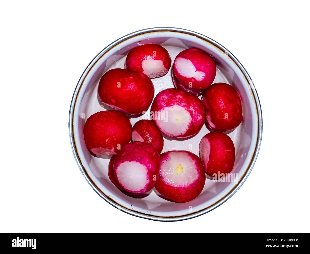 Red radish vegetable in a plate on a white background. Red radish ...