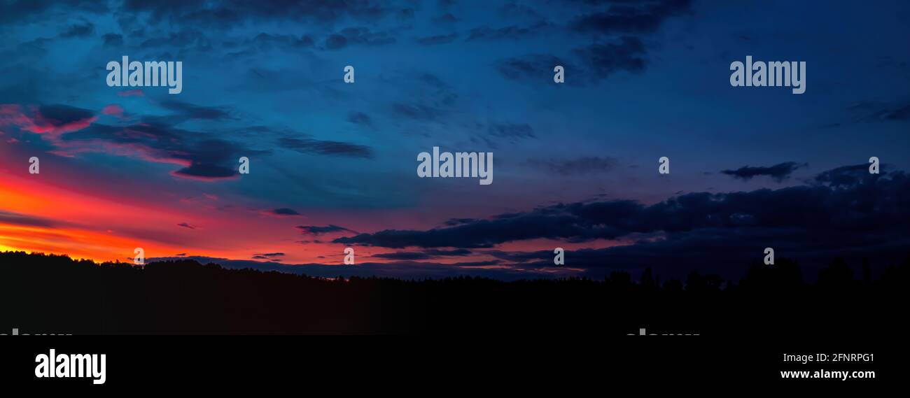 Red sunny sunset with thunderclouds on the horizon. Sky with clouds ...