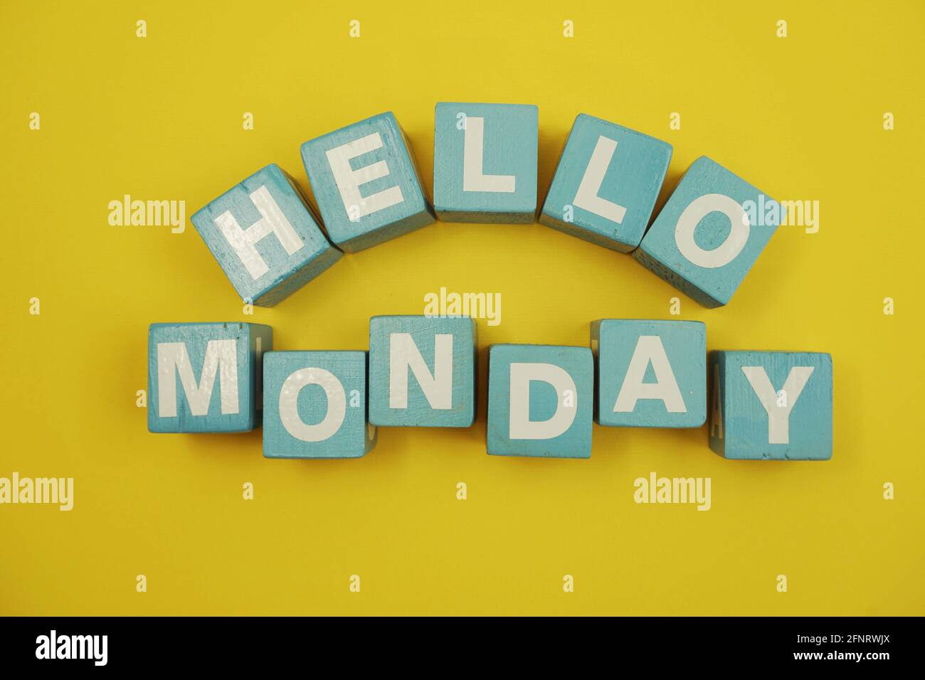 Hello Monday alphabet letters on yellow background Stock Photo - Alamy
