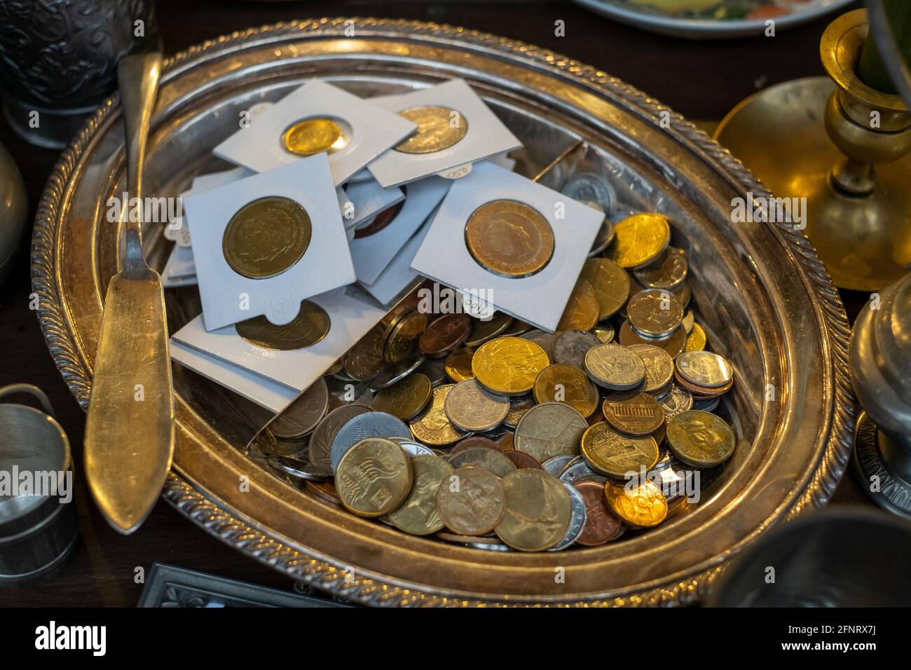 Collection of coins on stall at market Stock Photo - Alamy