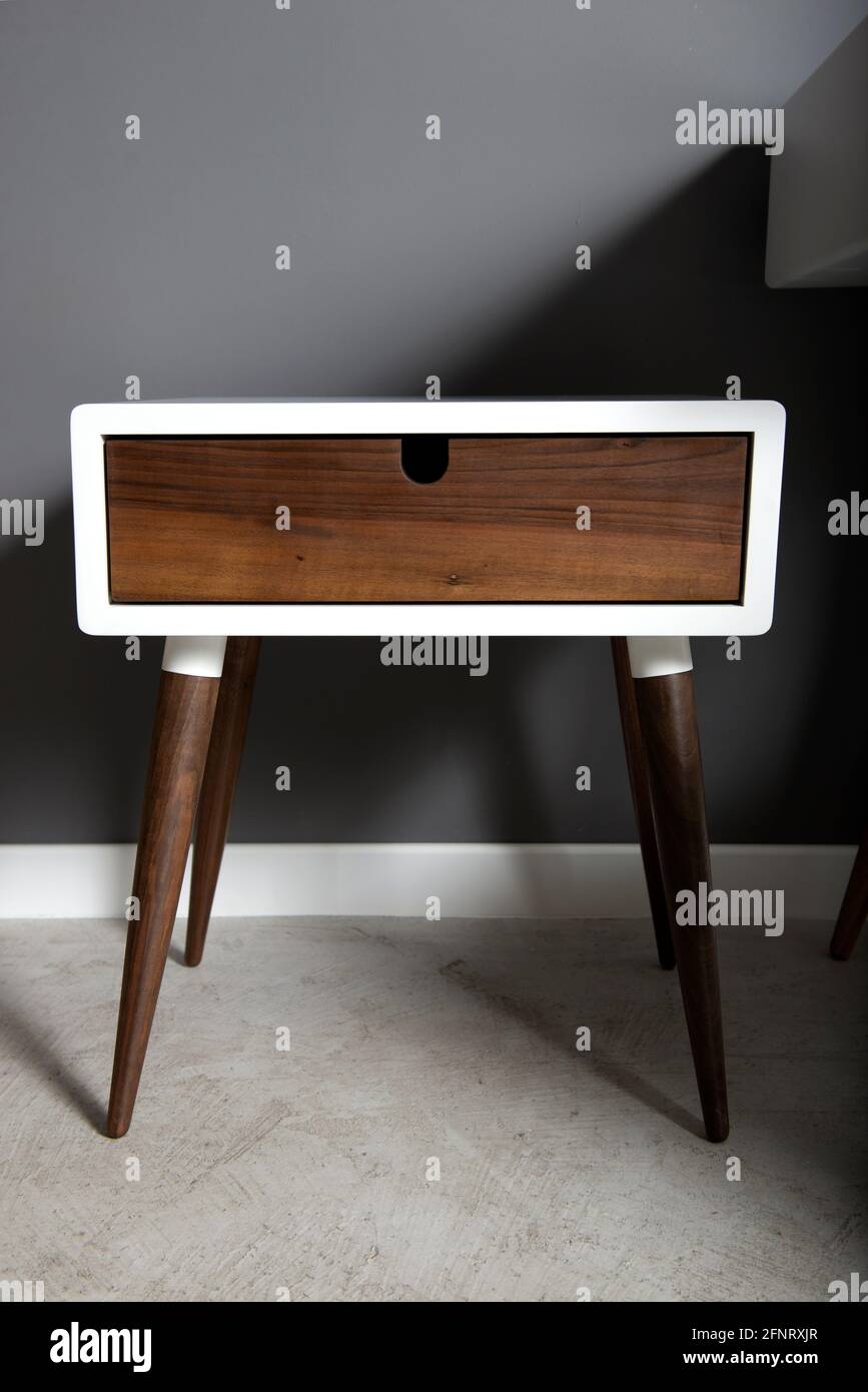 Small and modern wooden commode Stock Photo - Alamy
