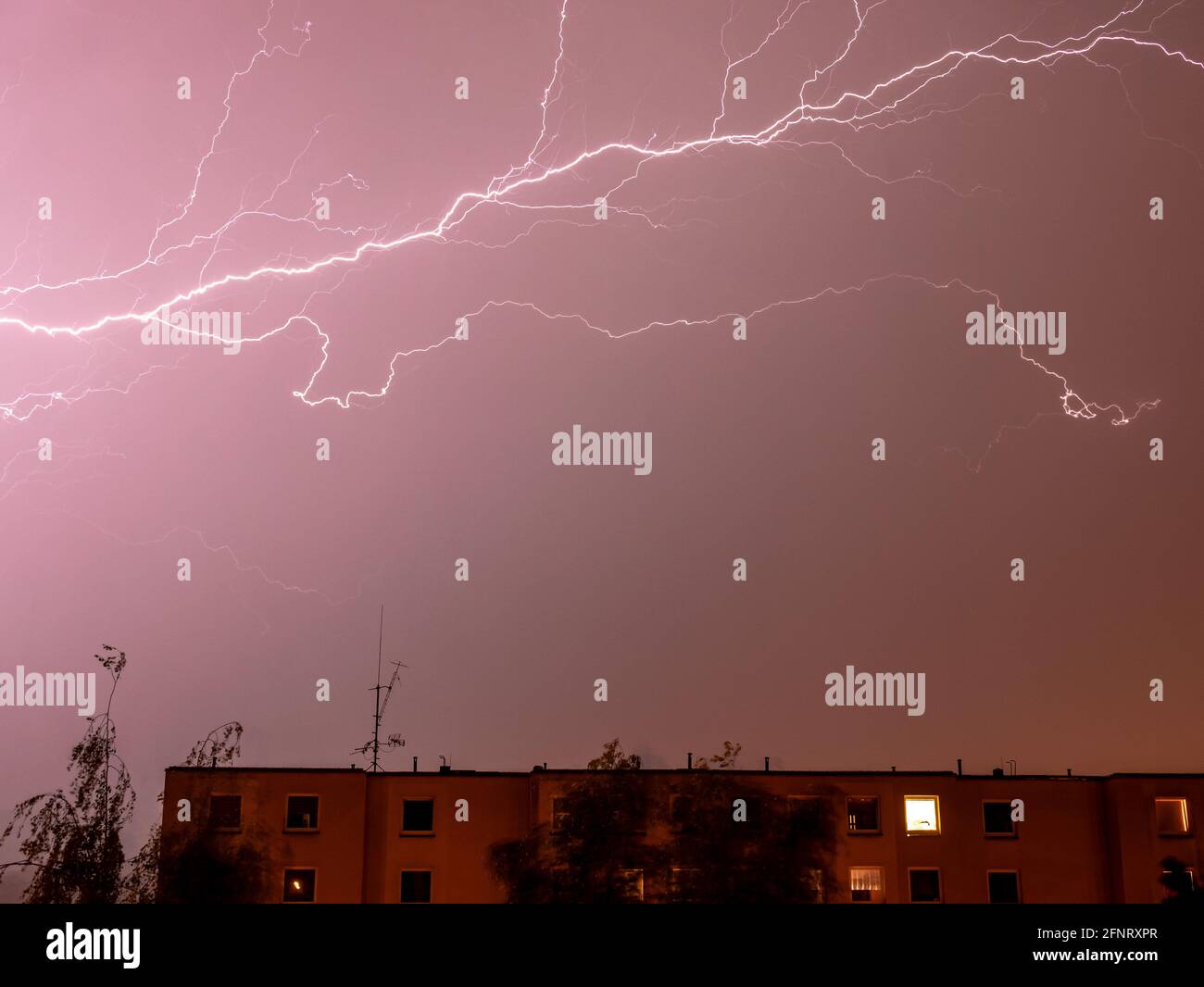 Lightning over a residential house - long exposure at night Stock Photo ...