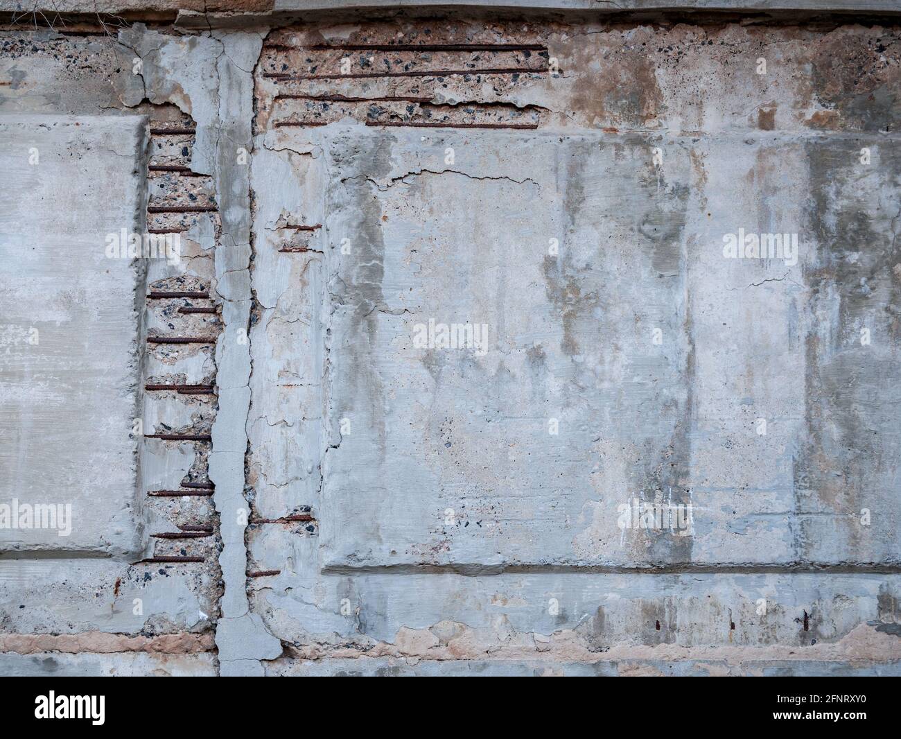 Old concrete wall with exposed iron reinforcement Stock Photo - Alamy