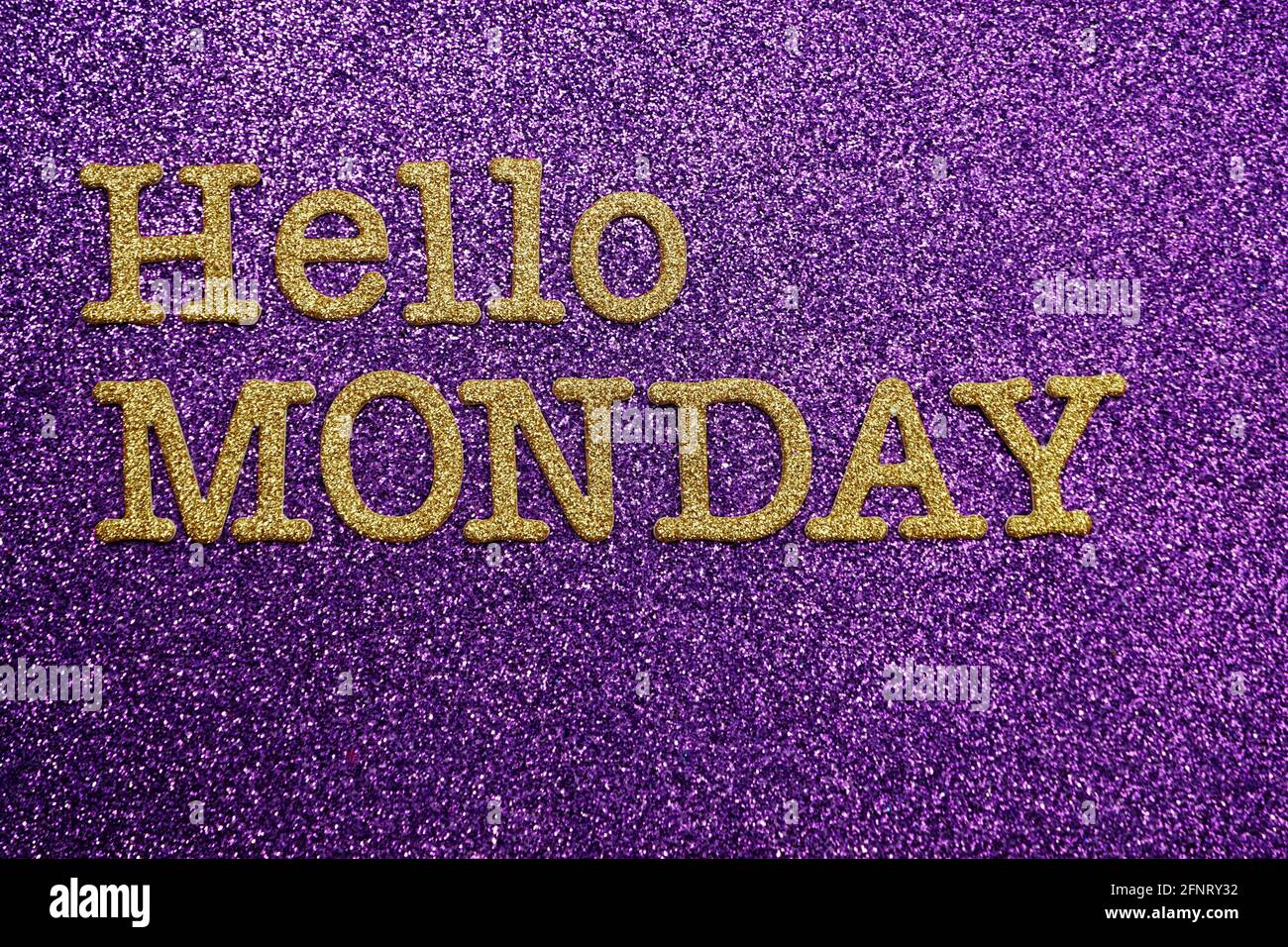 Hello Monday alphabet letter on purple glitter background Stock Photo ...