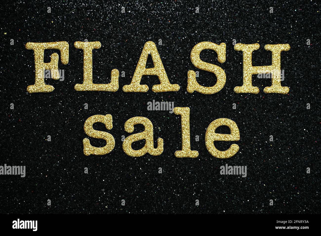 Flash sale alphabet letter on black glitter background Stock Photo - Alamy