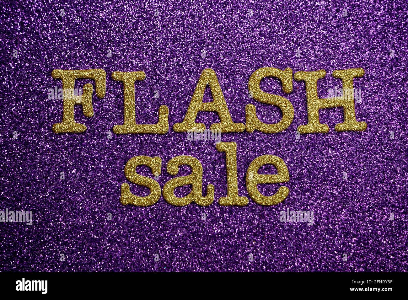 Flash sale alphabet letter on purple glitter background Stock Photo - Alamy