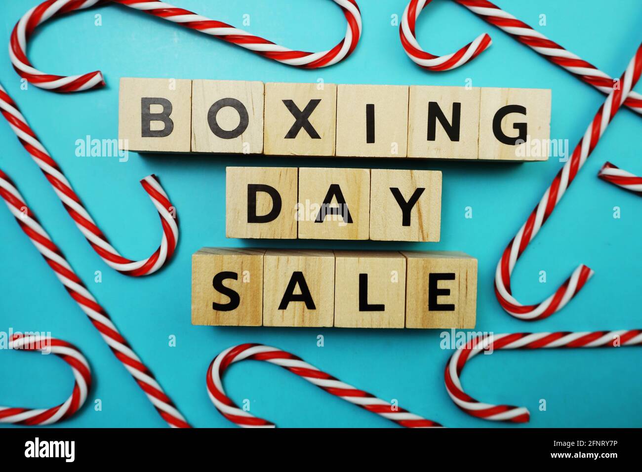 Boxing Day Sale alphabet letter with candy cane decoration on blue ...