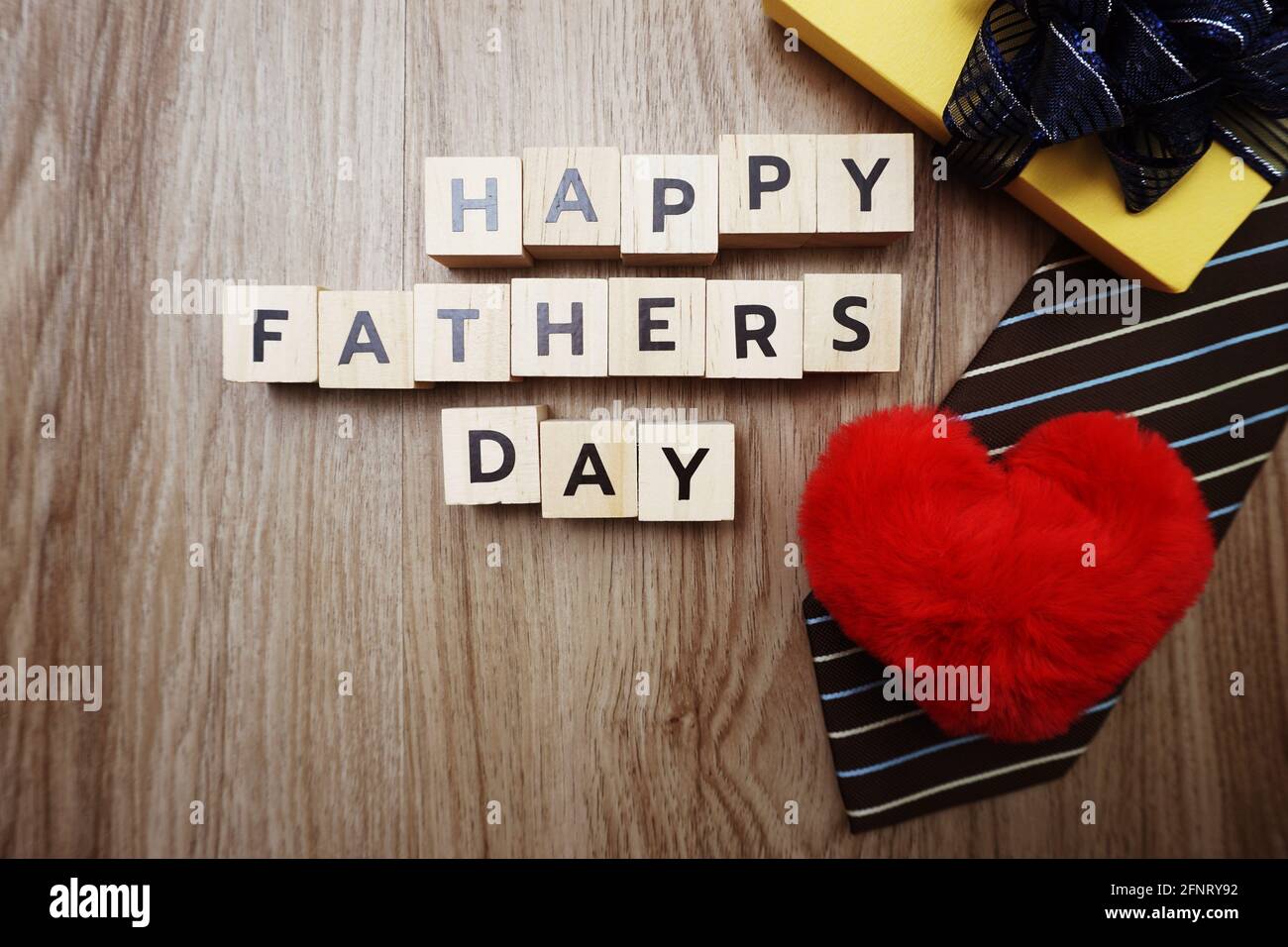 Happy Father's Day alphabet letters with necktie gift box and red heart ...
