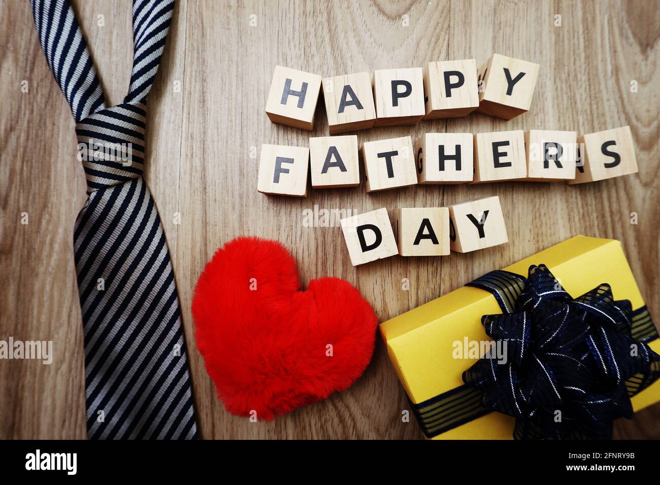Happy Father's Day alphabet letters with necktie gift box and red heart ...