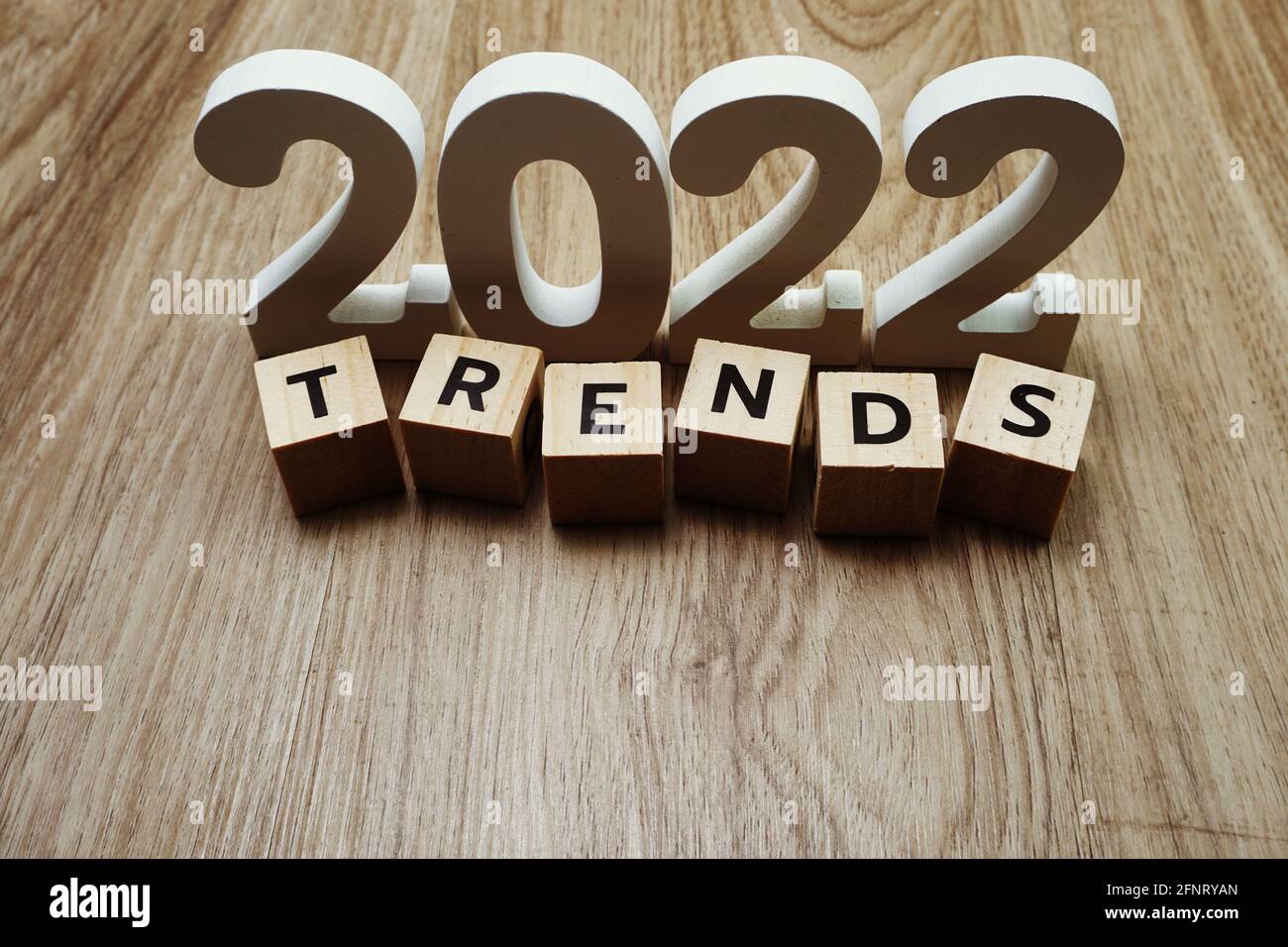 Trends 2022 word alphabet letters on wooden background Stock Photo - Alamy