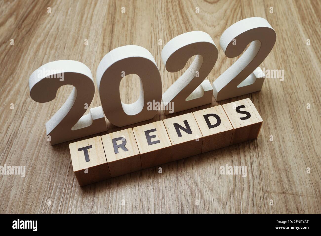 Trends 2022 word alphabet letters on wooden background Stock Photo - Alamy