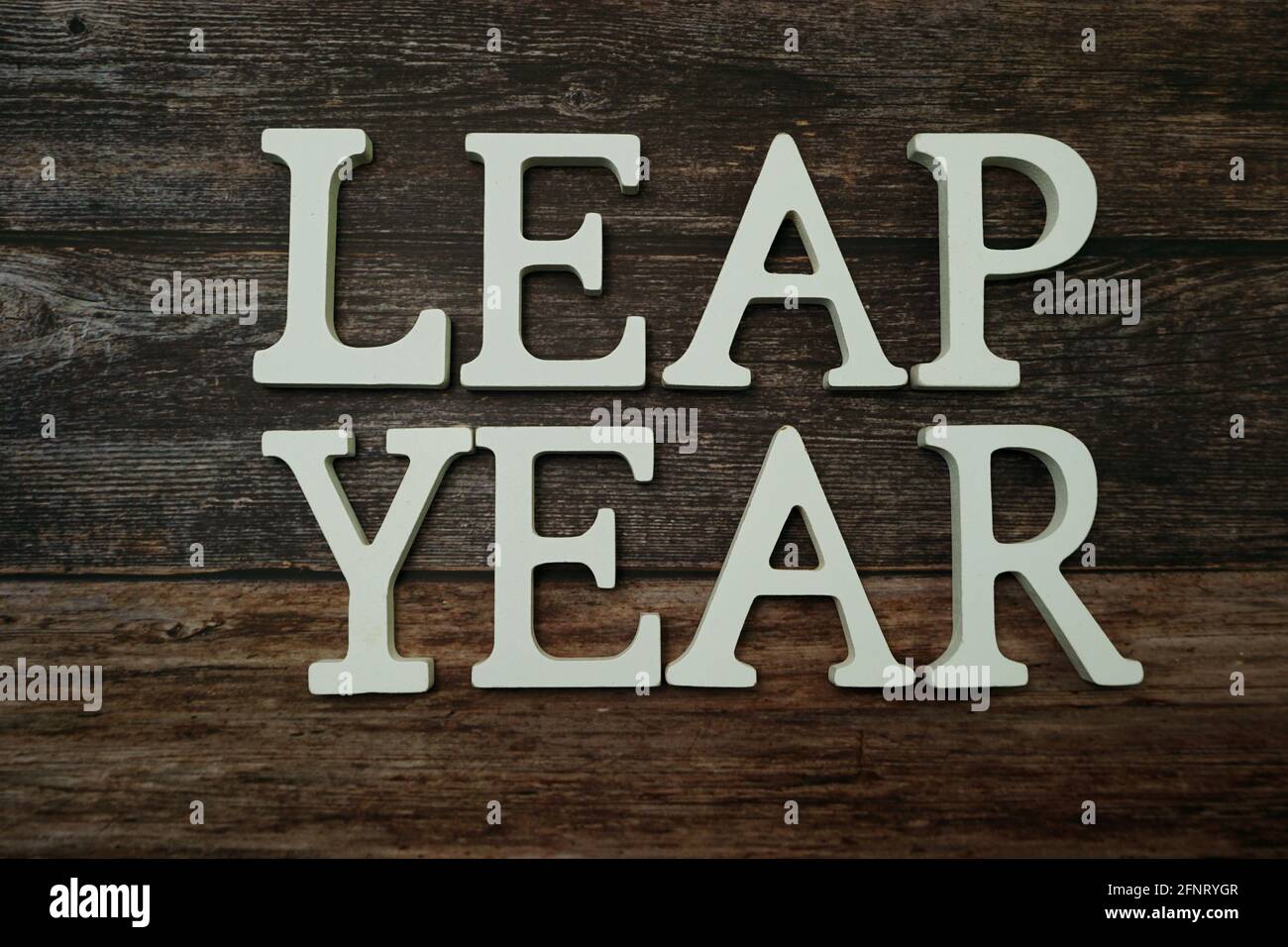 Leap Year alphabet letter with space copy on wooden background Stock ...