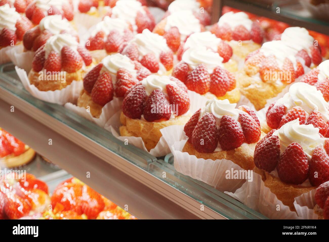 Strawberry Cream Puff in Bakery Shop Stock Photo - Alamy