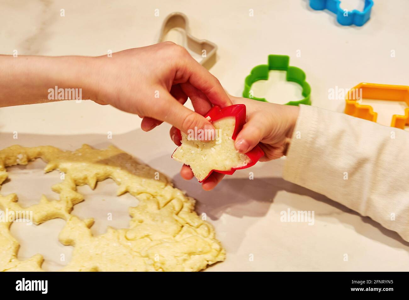 Two brothers cooking holiday cookies in the kitchen. Family traditions ...