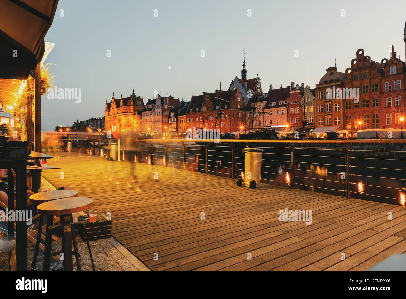 Gdansk night city riverside view, wooden embankment and street cafe on ...