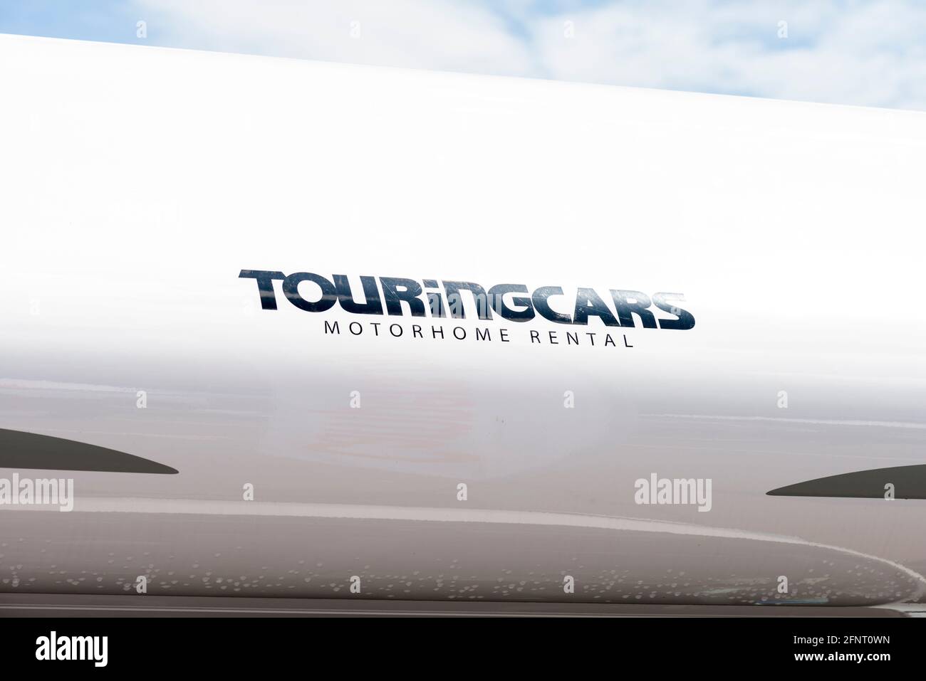 Touring Cars motorhome rental sign and logo on campervan Stock Photo ...