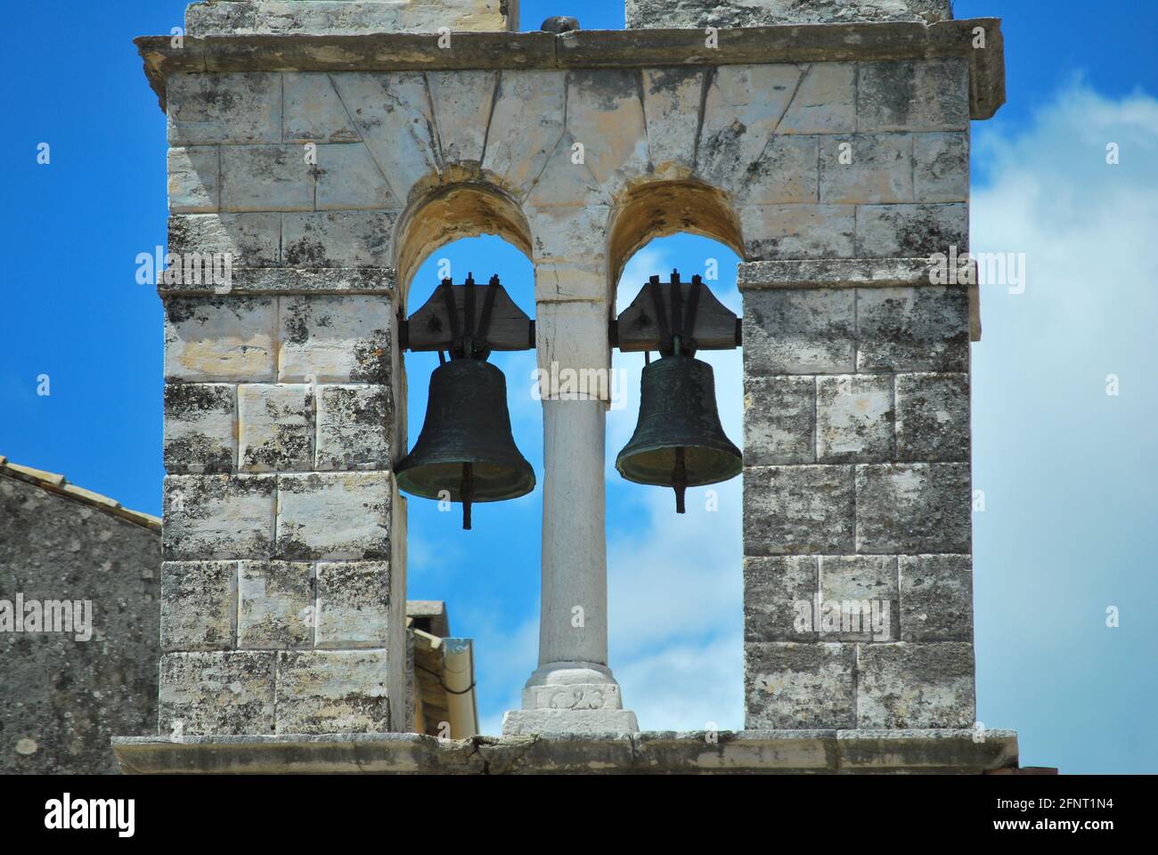 Two (2) bells on an old limestone structure in Greece Stock Photo - Alamy