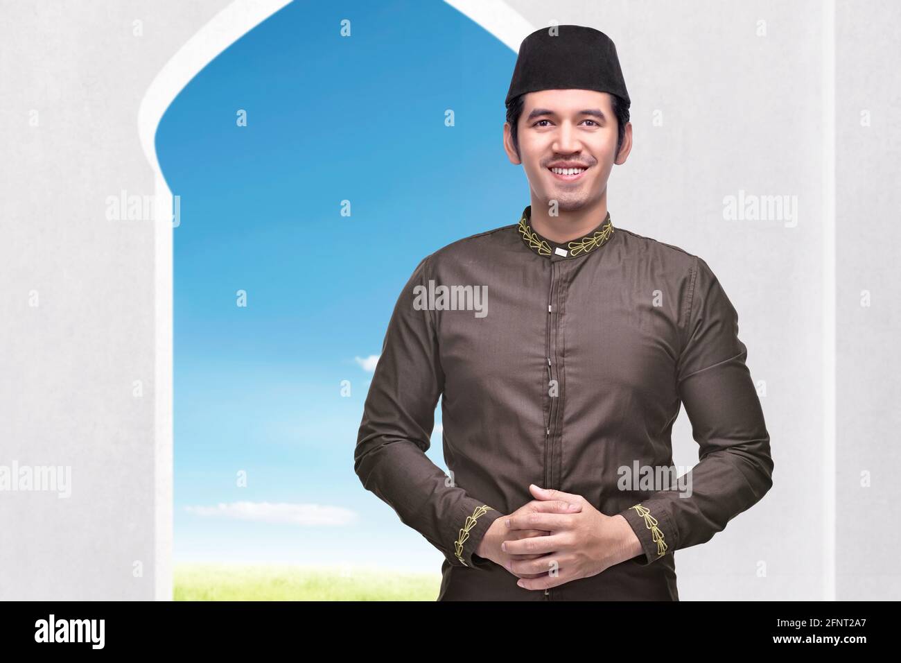 Asian Muslim man standing in the mosque Stock Photo - Alamy