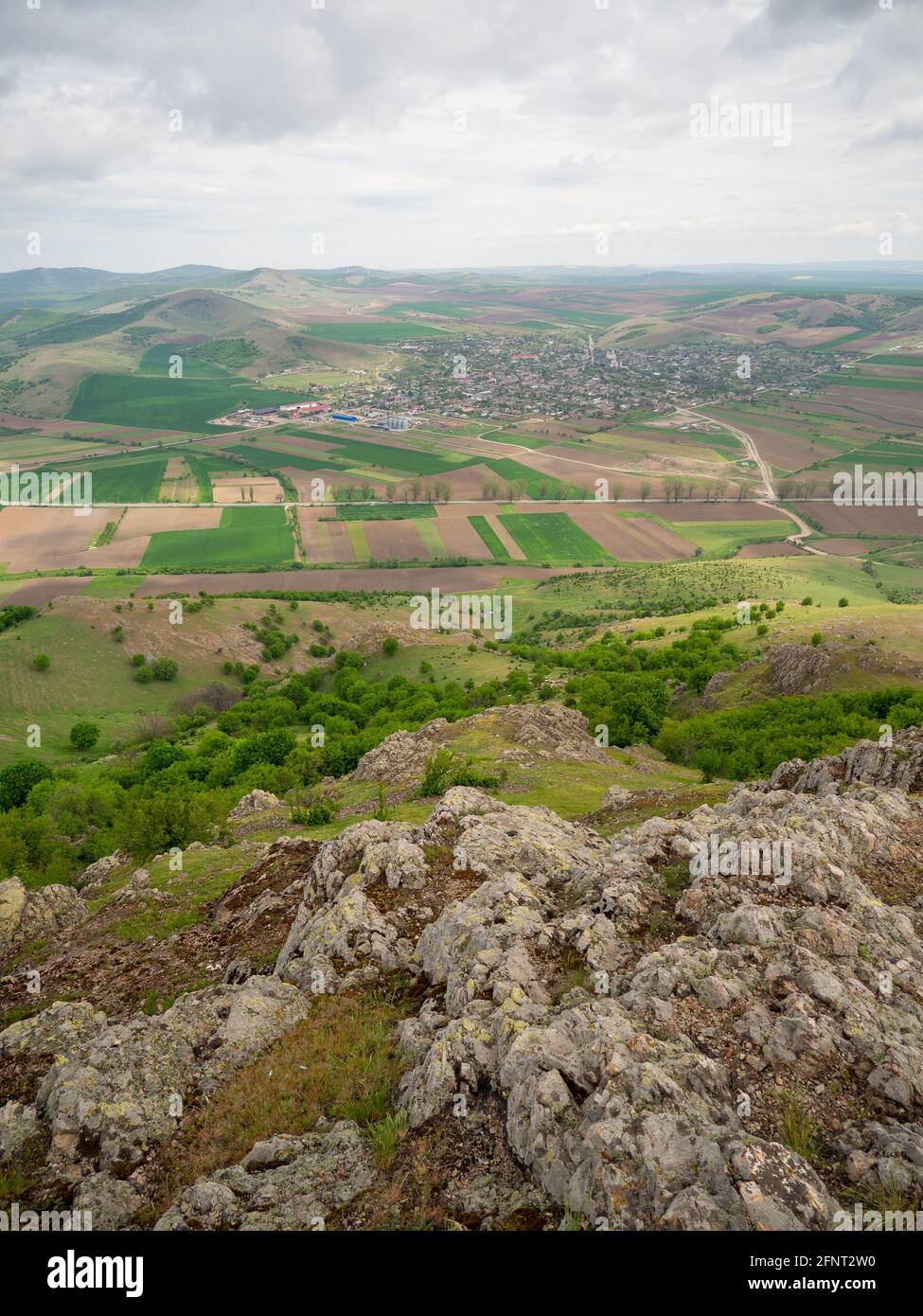 Vertical shot of beautiful landscape under a cloudy sky in the Dobrogea ...