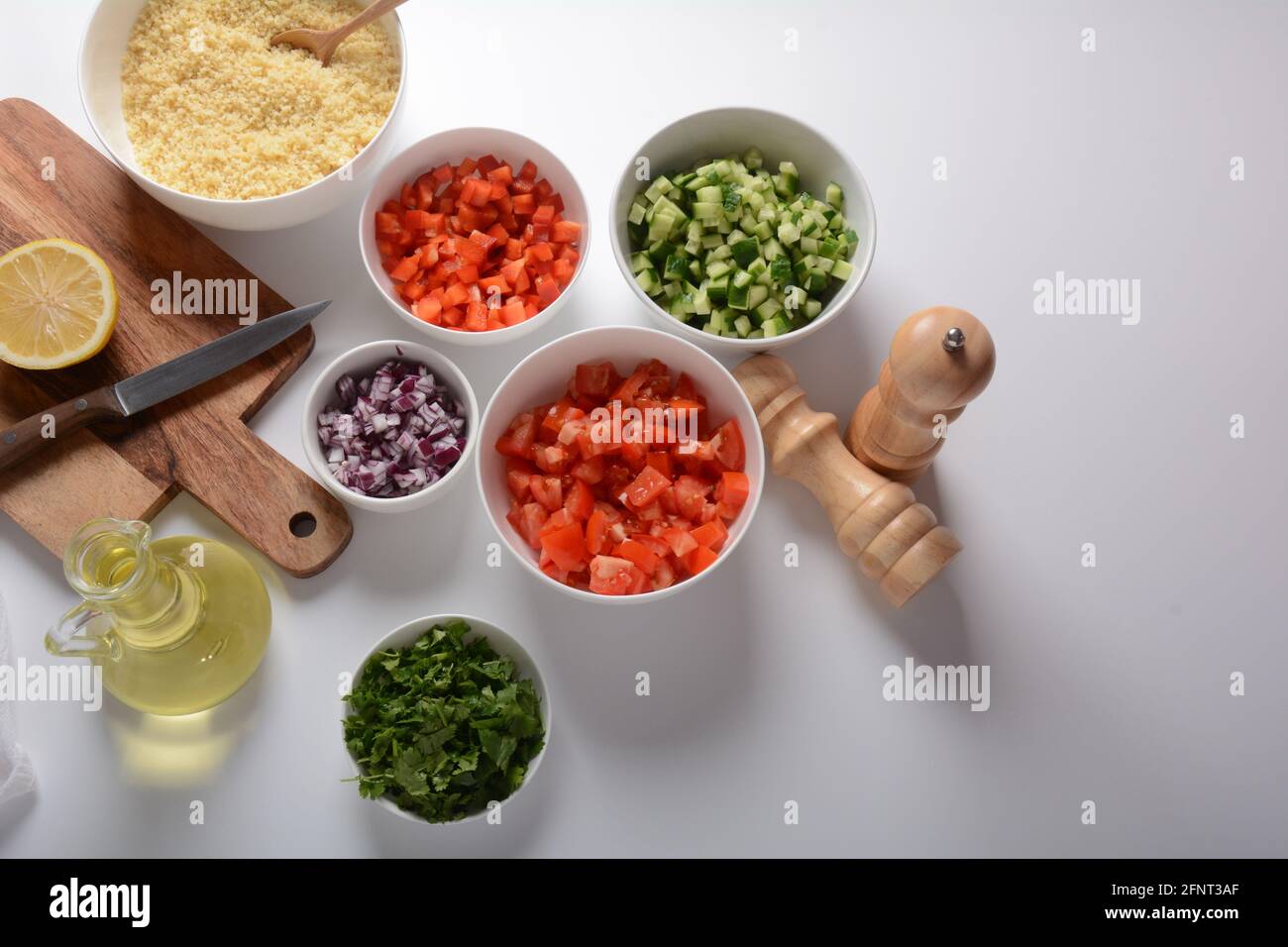 White bowls with grated vegetables of different colors. Cooking board ...