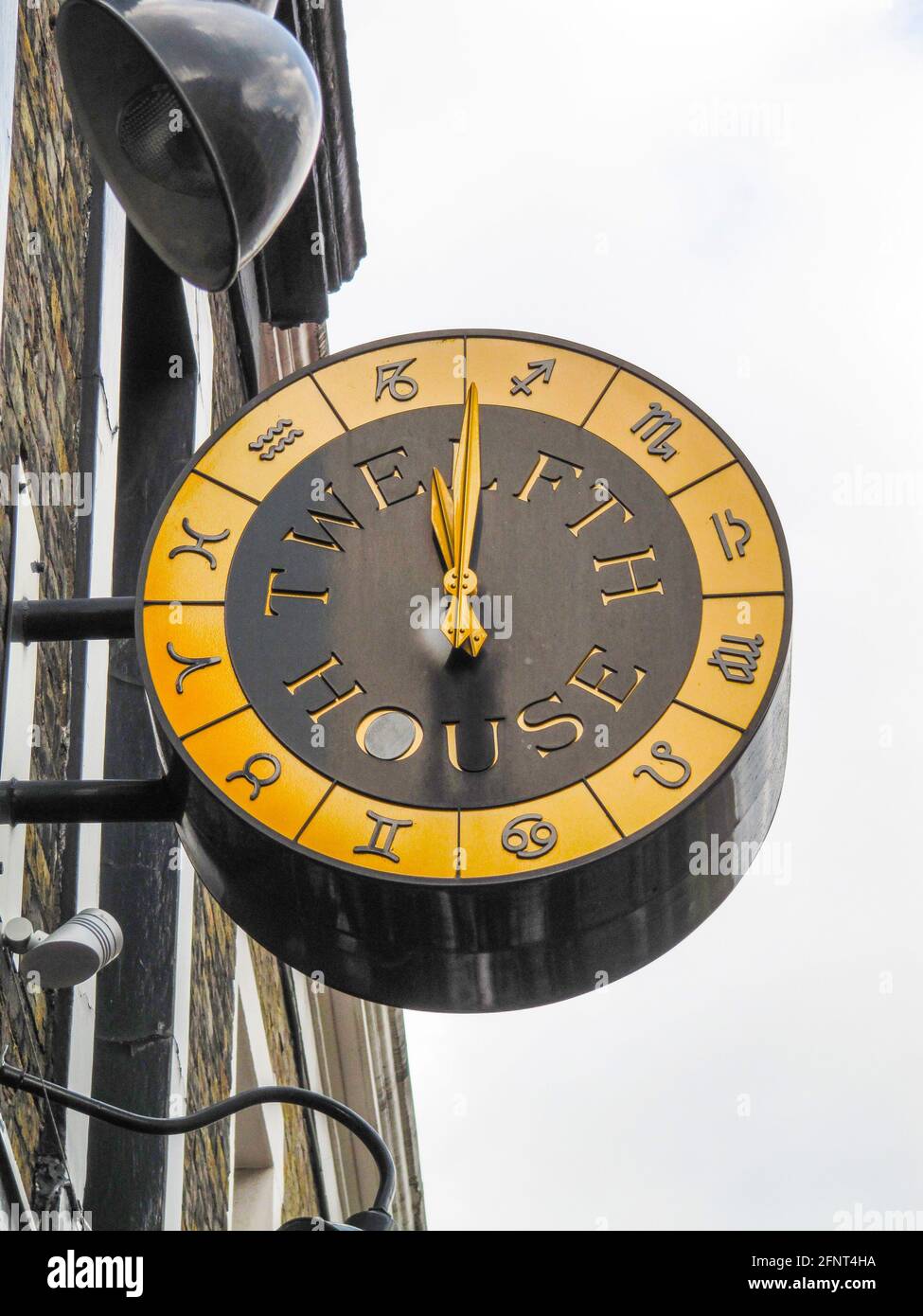 The external sign and clock of Twelfth House Pub, London, UK Stock ...