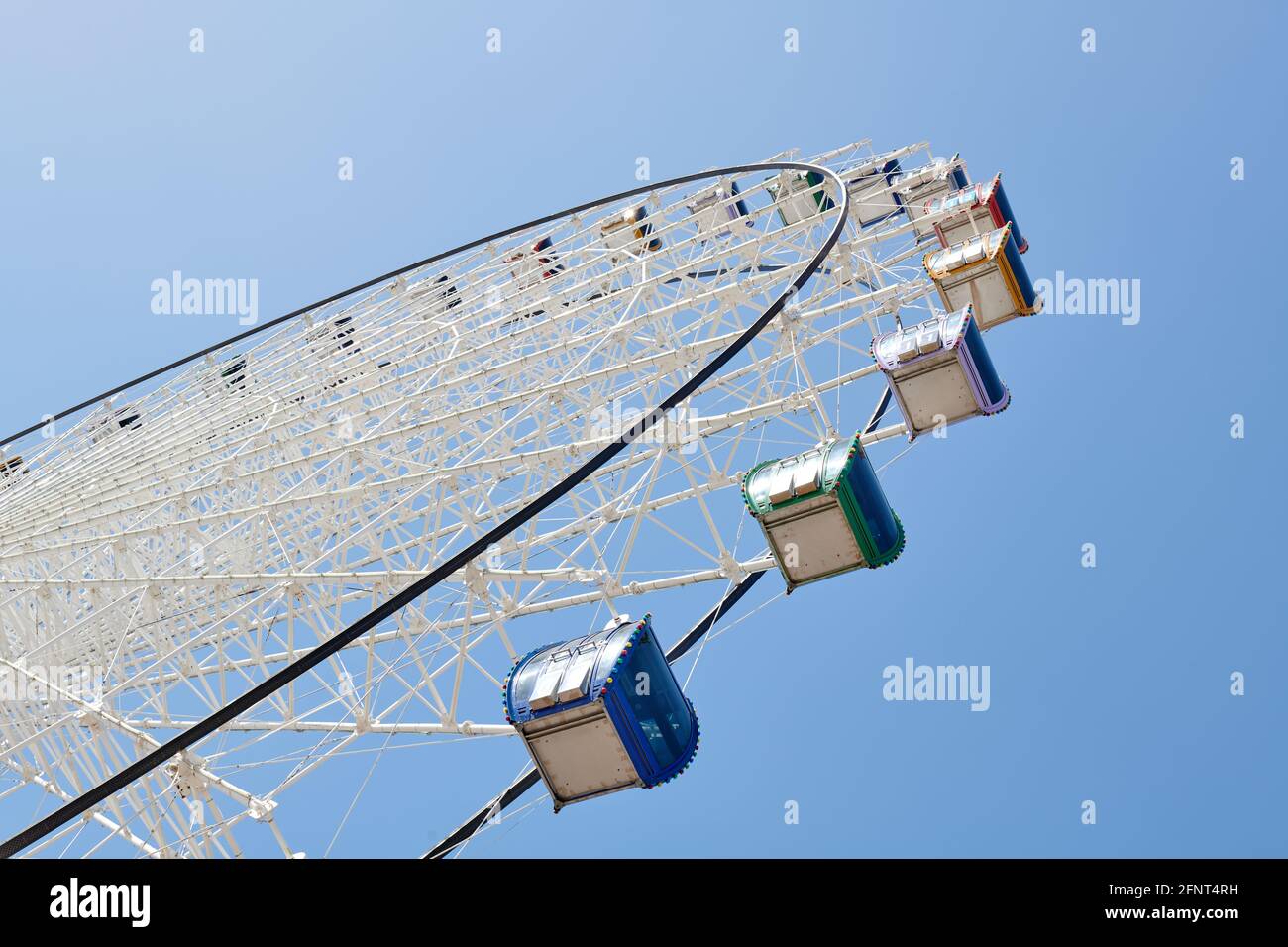 the big ferris wheel is visible behind the trees Stock Photo - Alamy