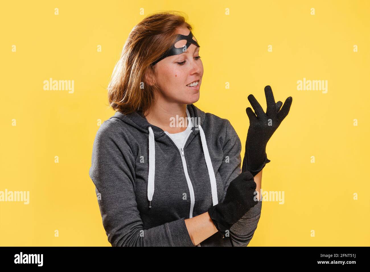 Female robber in mask hi-res stock photography and images - Alamy