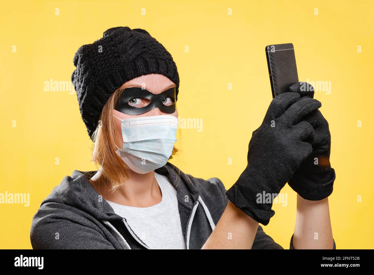 Female hacker in black mask hi-res stock photography and images - Alamy