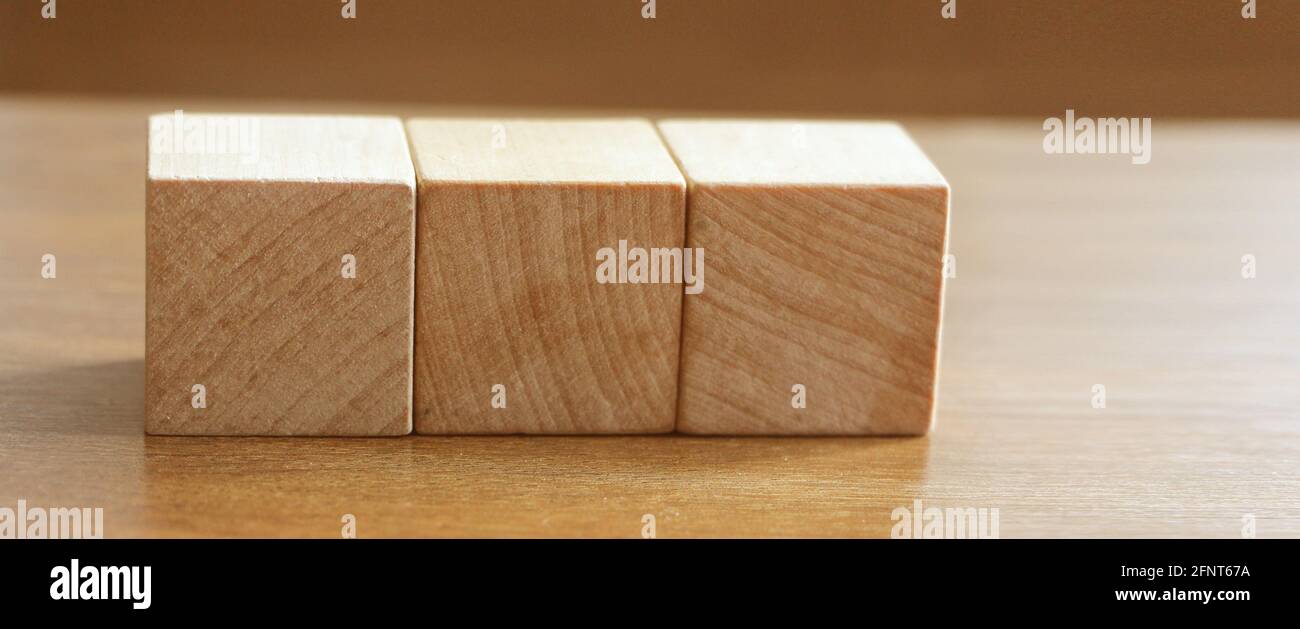 3 Wood Blocks Front View, On Wooden Table, polished wooden table ...