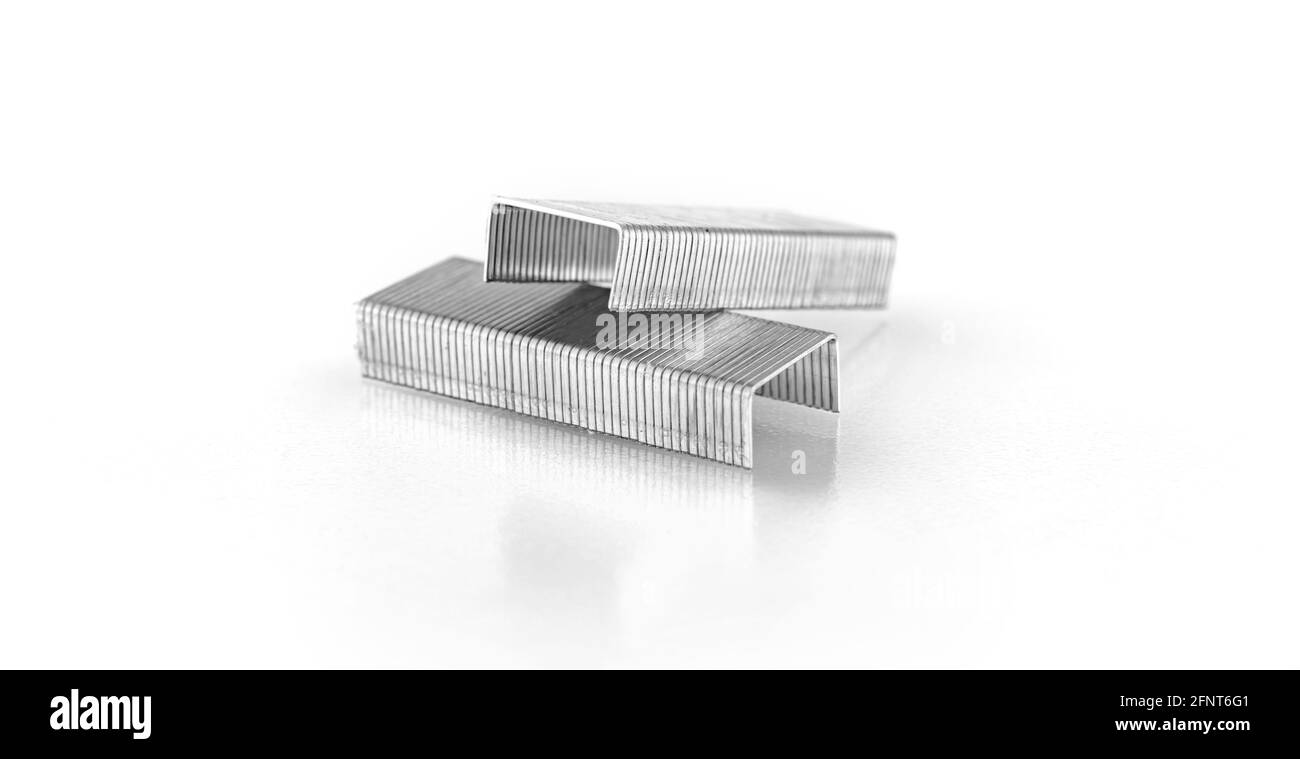 Staples clips isolated on a white background Stock Photo - Alamy